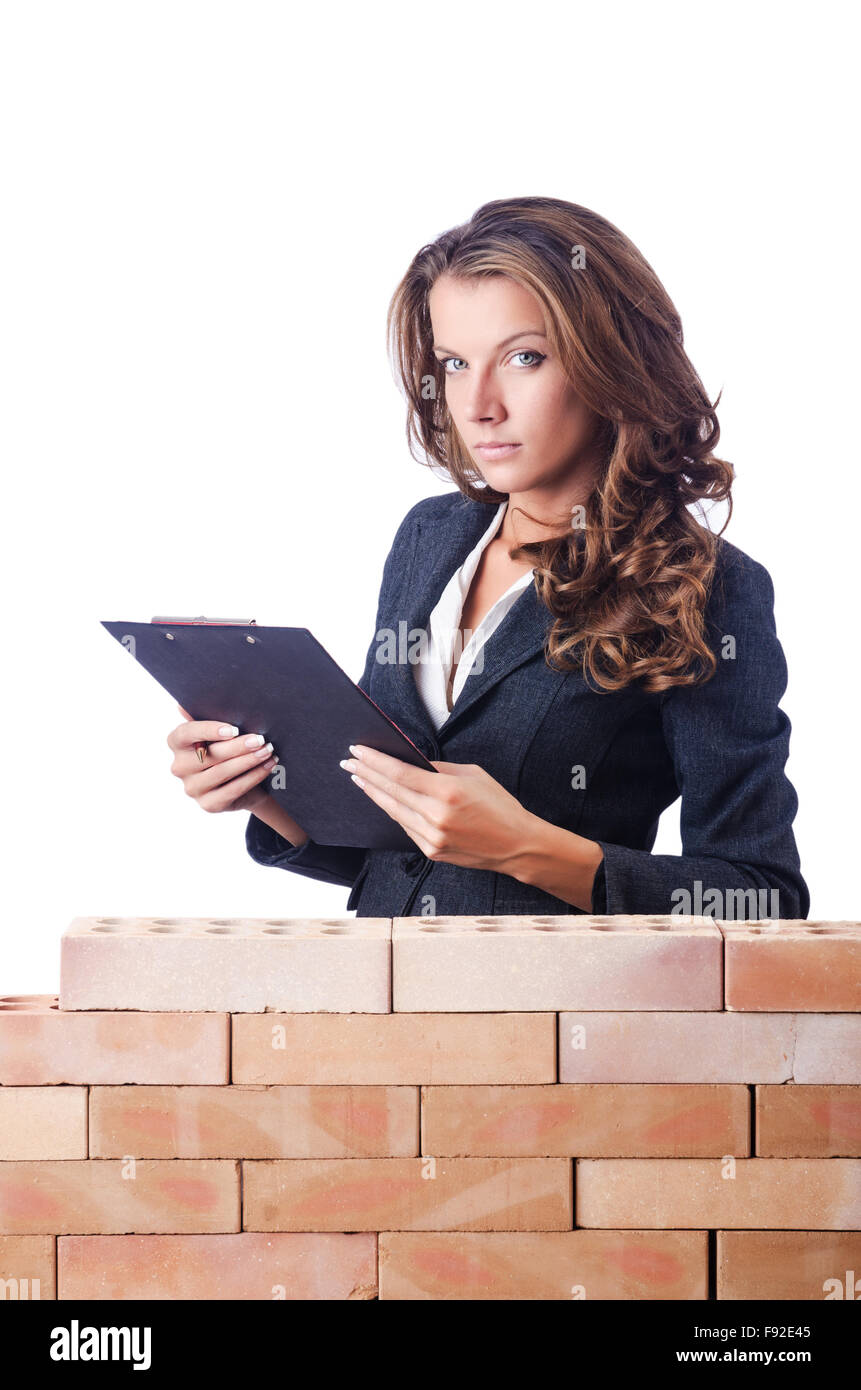 Woman builder and brick wall Stock Photo - Alamy
