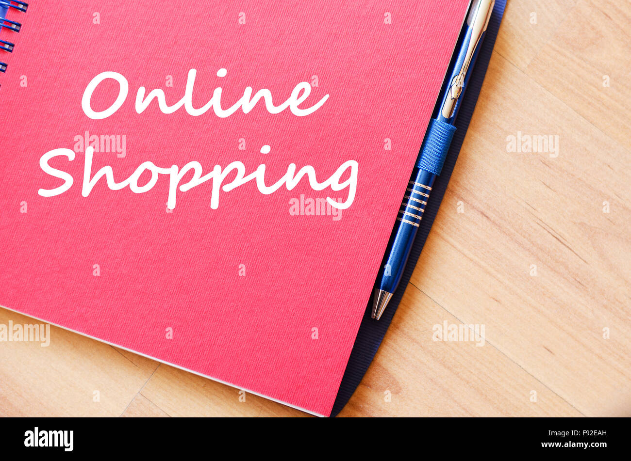 Online shopping text concept write on notebook with pen Stock Photo - Alamy