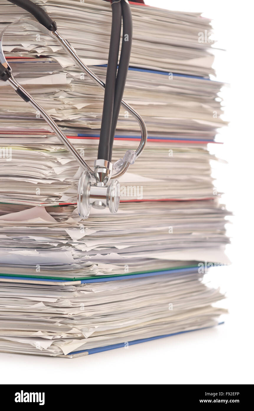 Stack of papers with stethoscope Stock Photo - Alamy