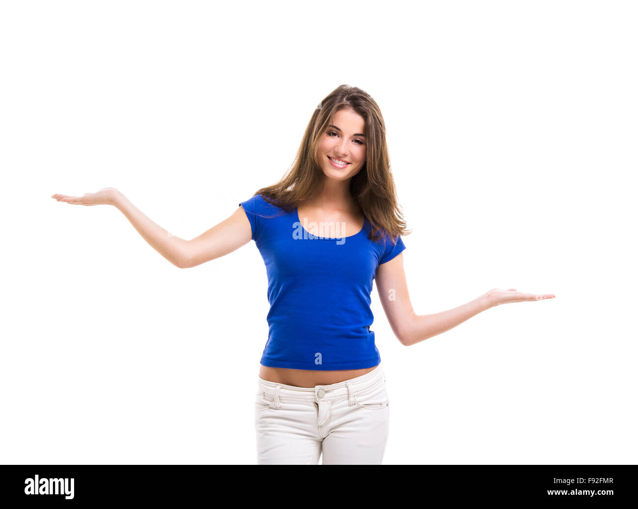 Beautiful young woman with arms open making a scale, isolated over a ...
