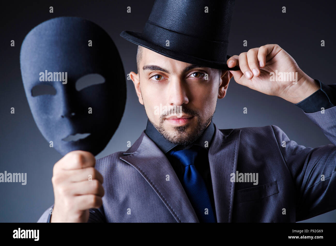 Man with masks in hypocrisy concept Stock Photo - Alamy