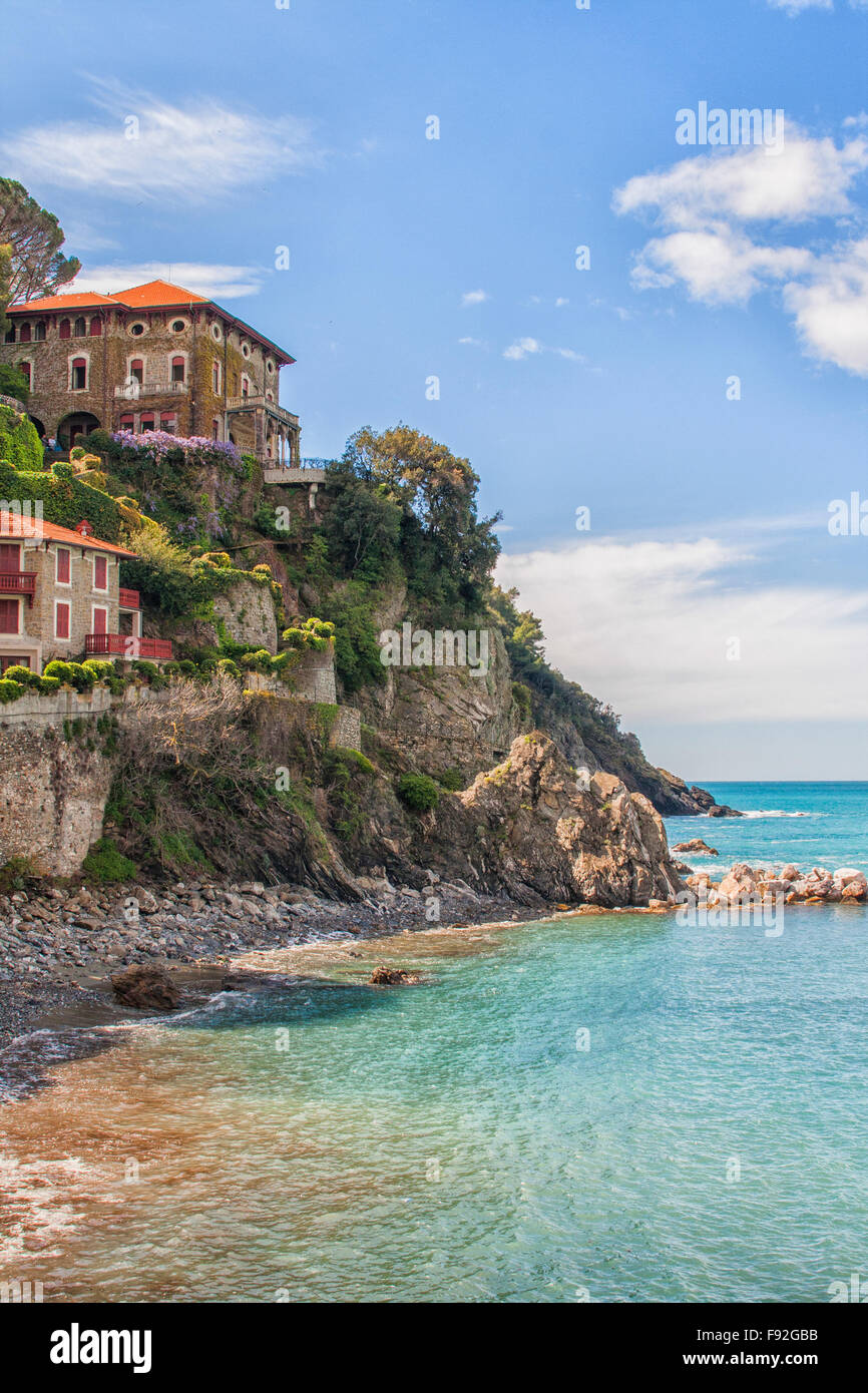Beautiful houses on rocks near the ocean in Italy Stock Photo - Alamy
