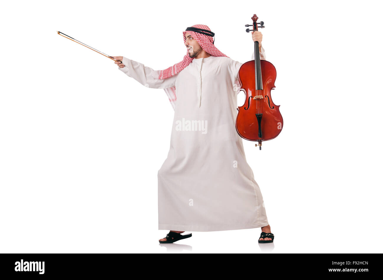 Arab man playing violin isolated on white Stock Photo - Alamy