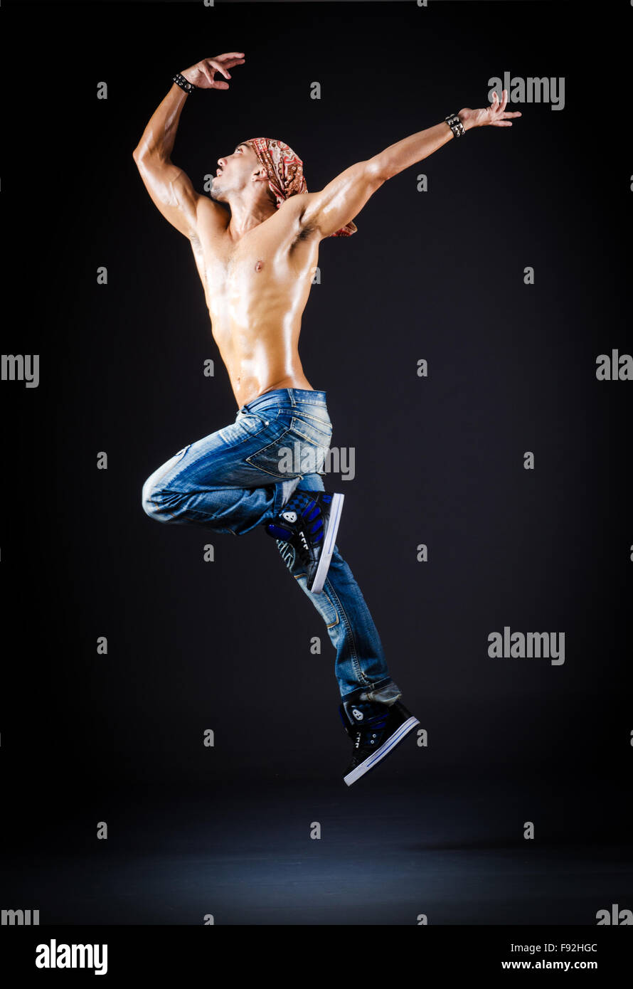 Dancer dancing in dark room Stock Photo - Alamy