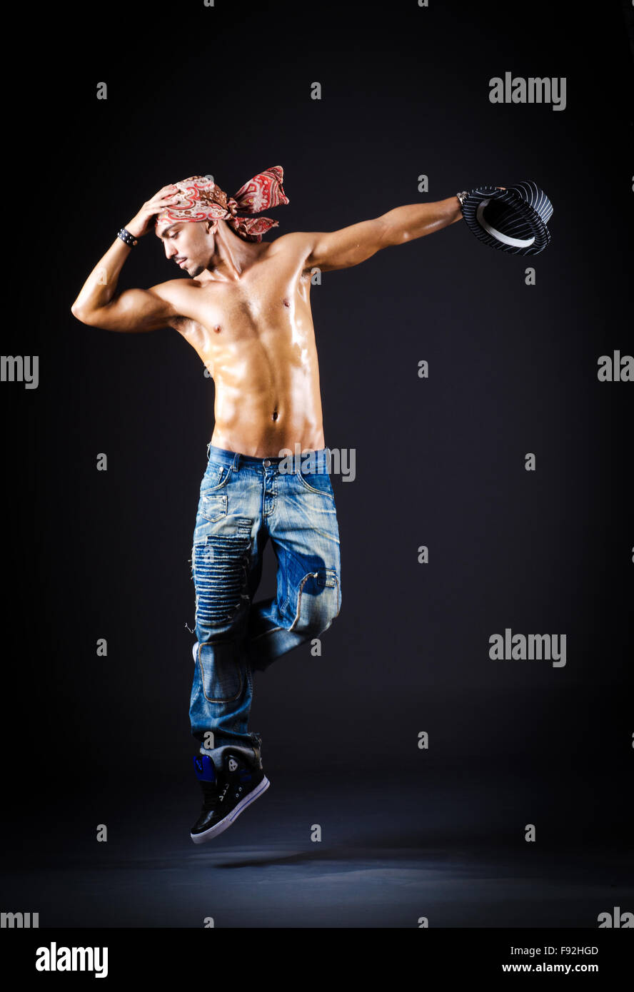 Dancer dancing in dark room Stock Photo - Alamy