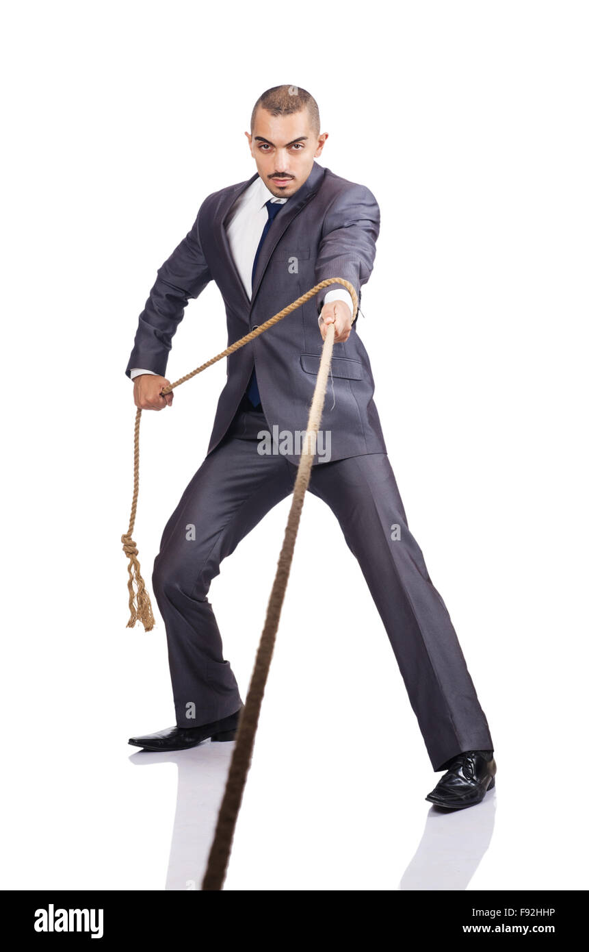 Man pulling the rope on white Stock Photo - Alamy