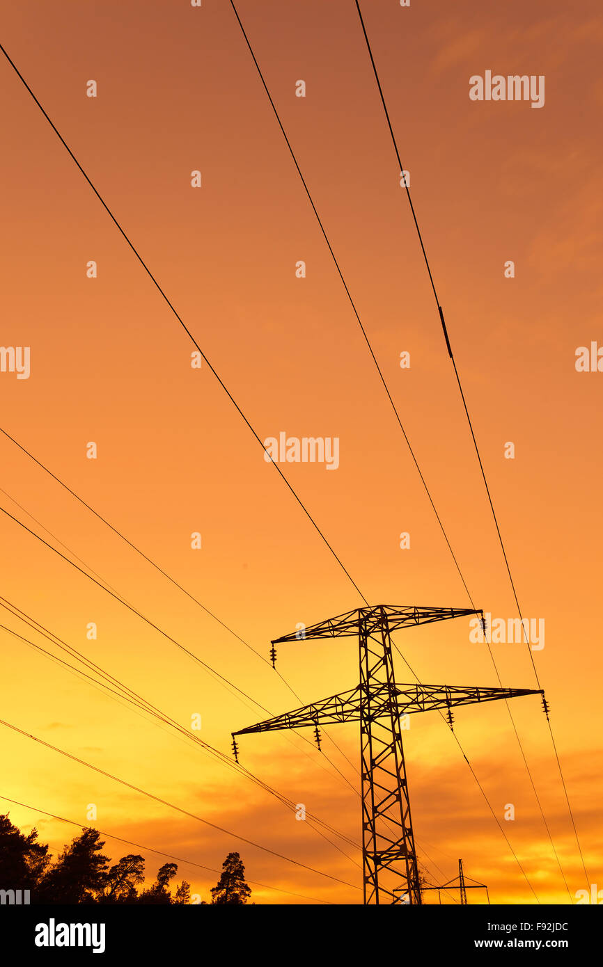 Power lines pylons and cables against sunset sky Stock Photo - Alamy