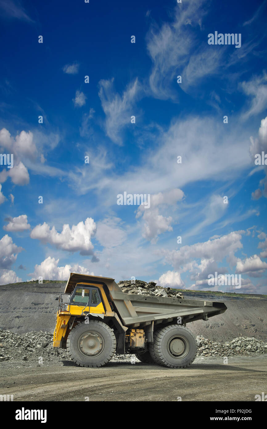 Heavy mining truck on the opencast with a load of iron ore Stock Photo ...