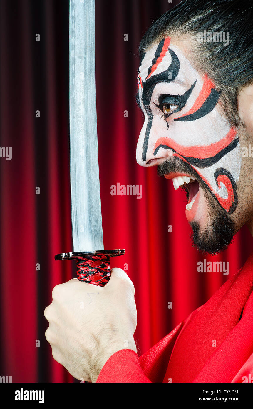 Man with sword and face mask Stock Photo - Alamy