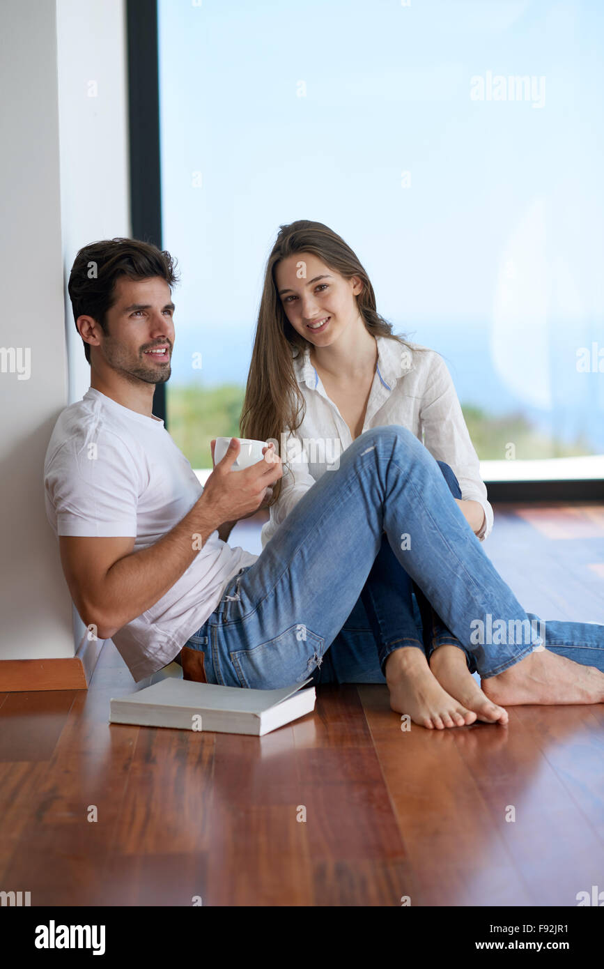romantic happy young couple relax at modern home staircase indoors ...