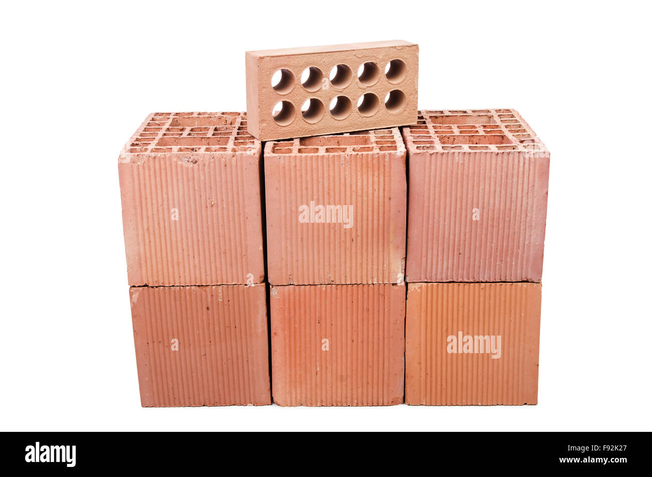 Stack of clay bricks isolated on white Stock Photo - Alamy