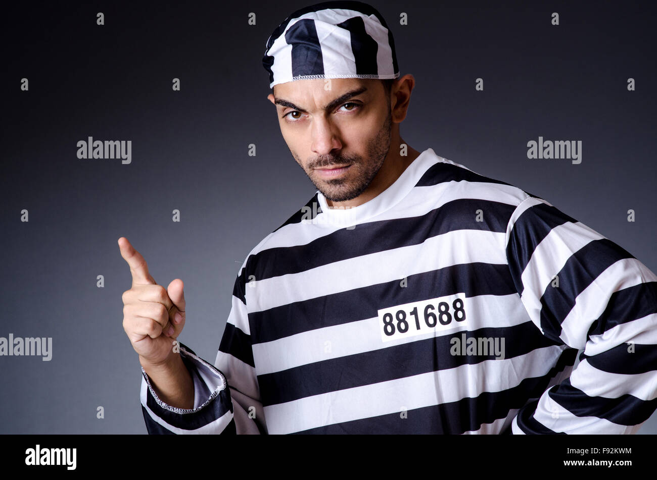 Convict criminal in striped uniform Stock Photo - Alamy