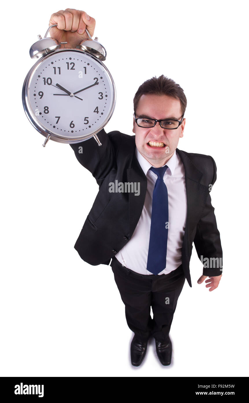 Funny businessman with gian clock on white Stock Photo - Alamy