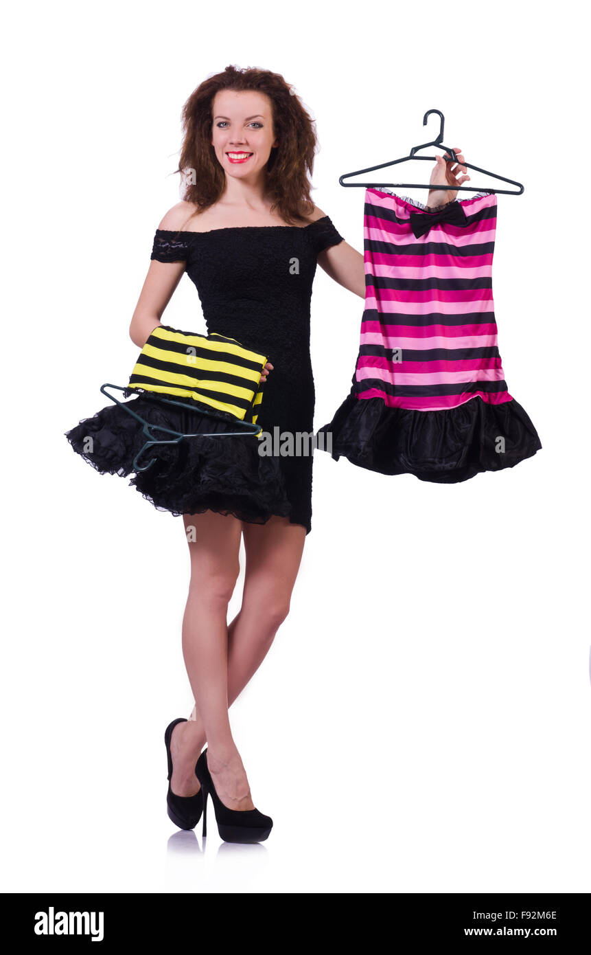 Woman trying to choose dress on white Stock Photo - Alamy