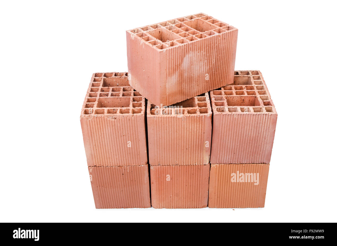 Stack of clay bricks isolated on white Stock Photo - Alamy