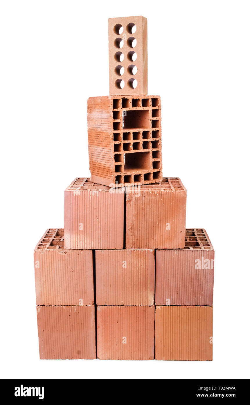 Stack of clay bricks isolated on white Stock Photo - Alamy