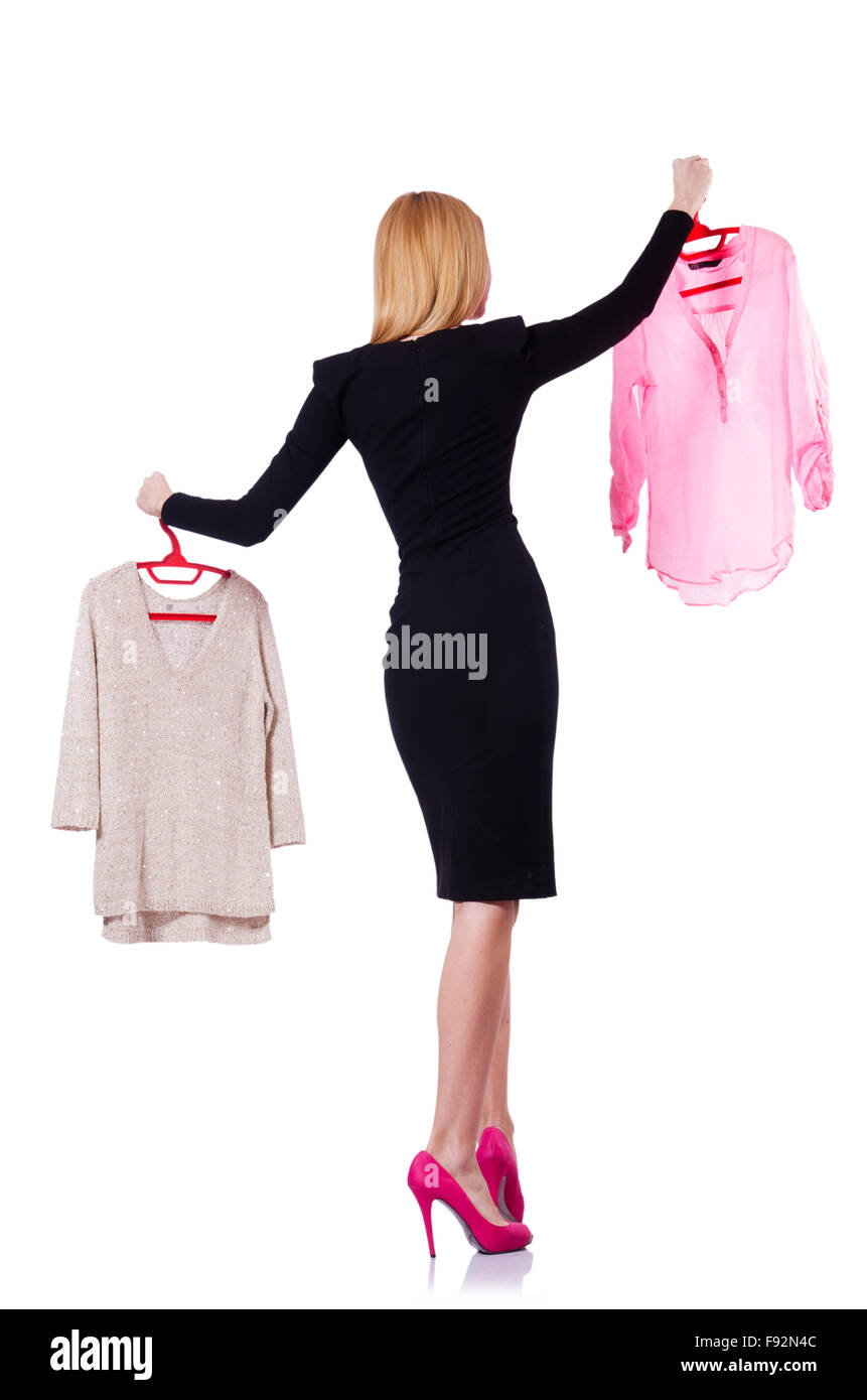 Woman trying to choose dress on white Stock Photo - Alamy