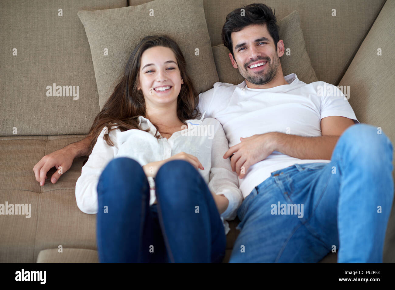 happy young romantic couple have fun relax smile at modern home outdoor ...