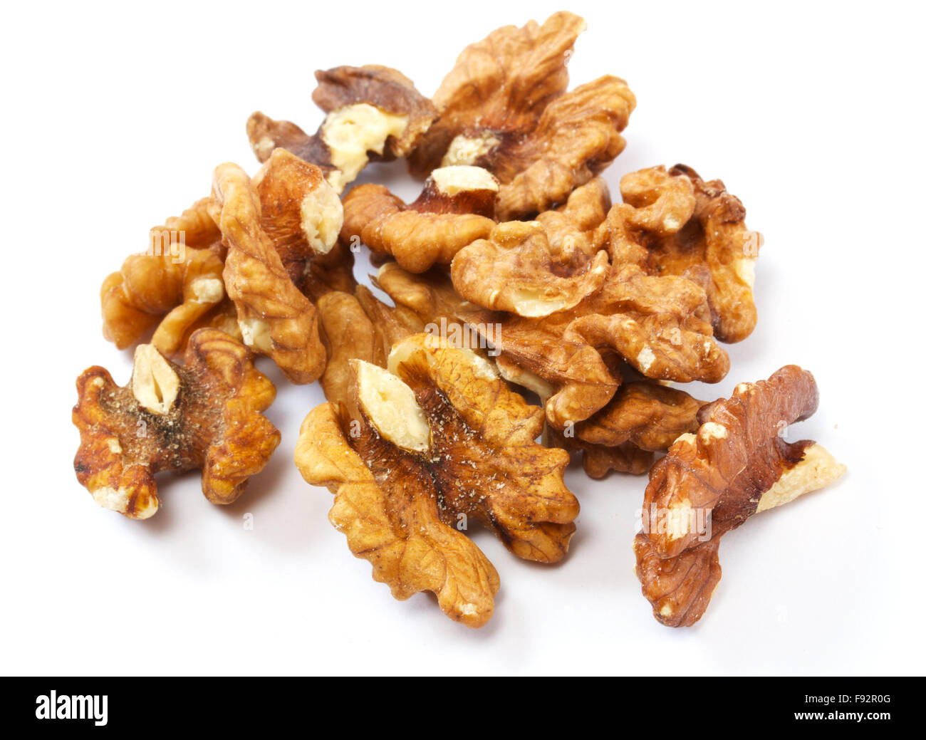 Crushed walnuts on white background Stock Photo - Alamy
