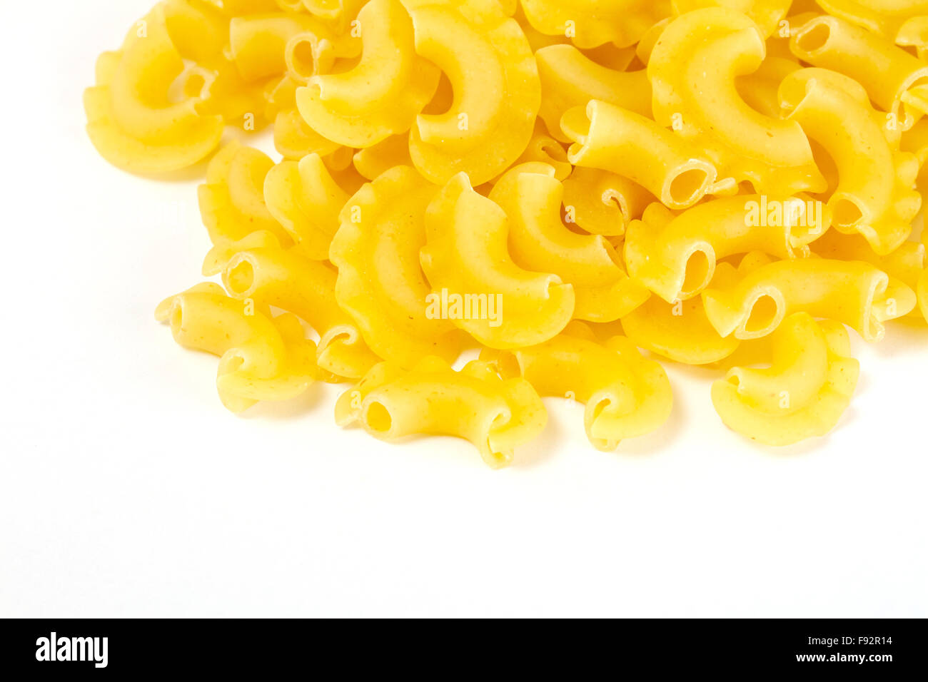 dried italian pasta (macaroni) isolated on white background Stock Photo ...