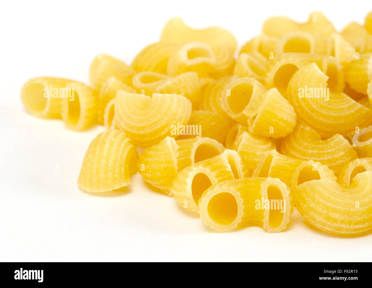 dried italian pasta (macaroni) isolated on white background Stock Photo ...