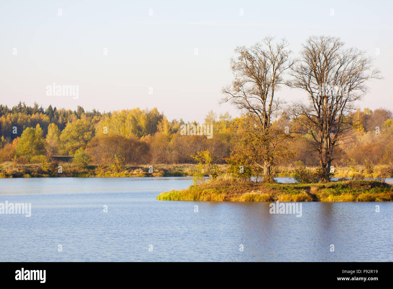 Colorful autumn trees fortress at the river front Stock Photo - Alamy