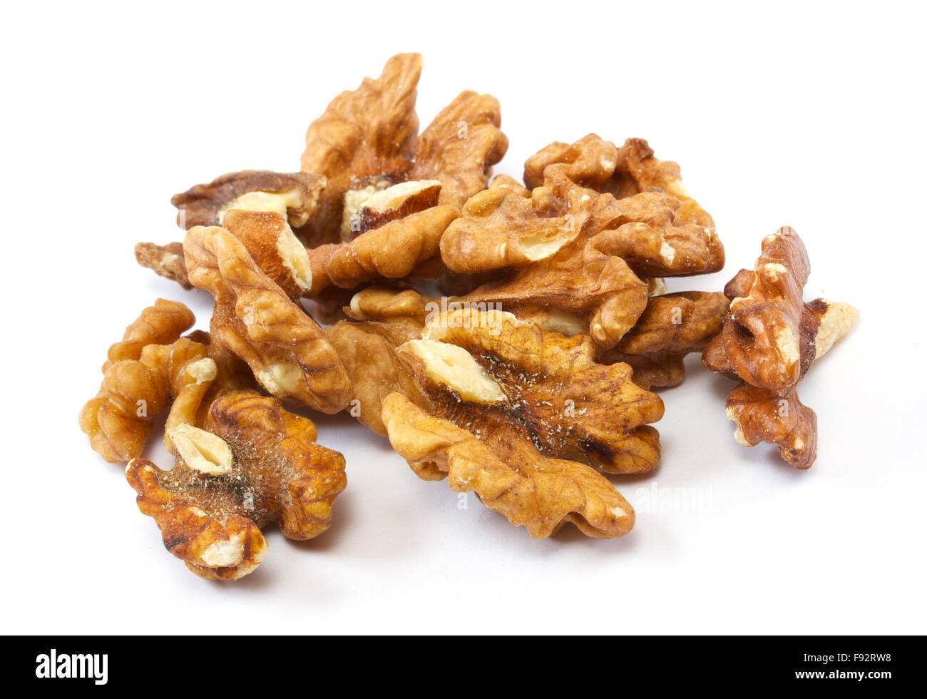 Crushed walnuts on white background Stock Photo - Alamy