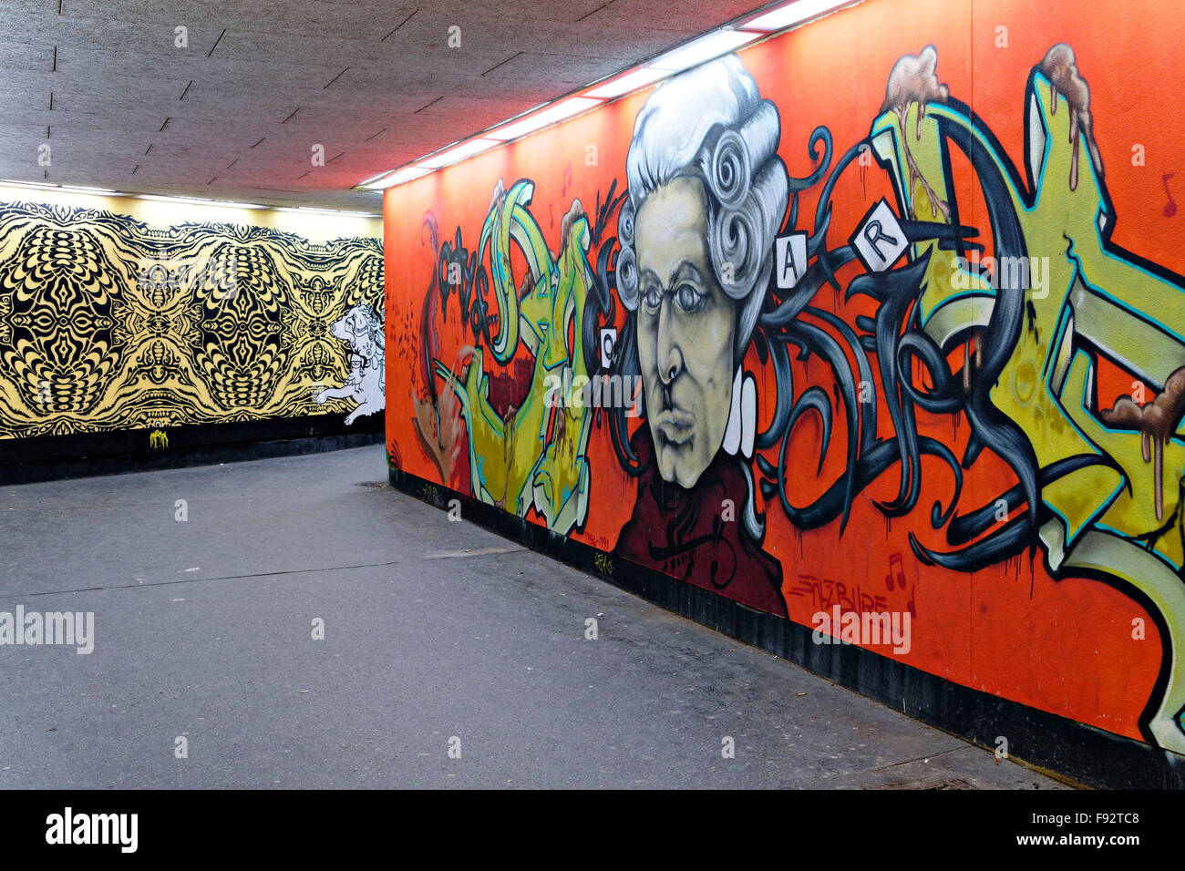 Graffiti with portrait of composer Mozart in underground passageway ...