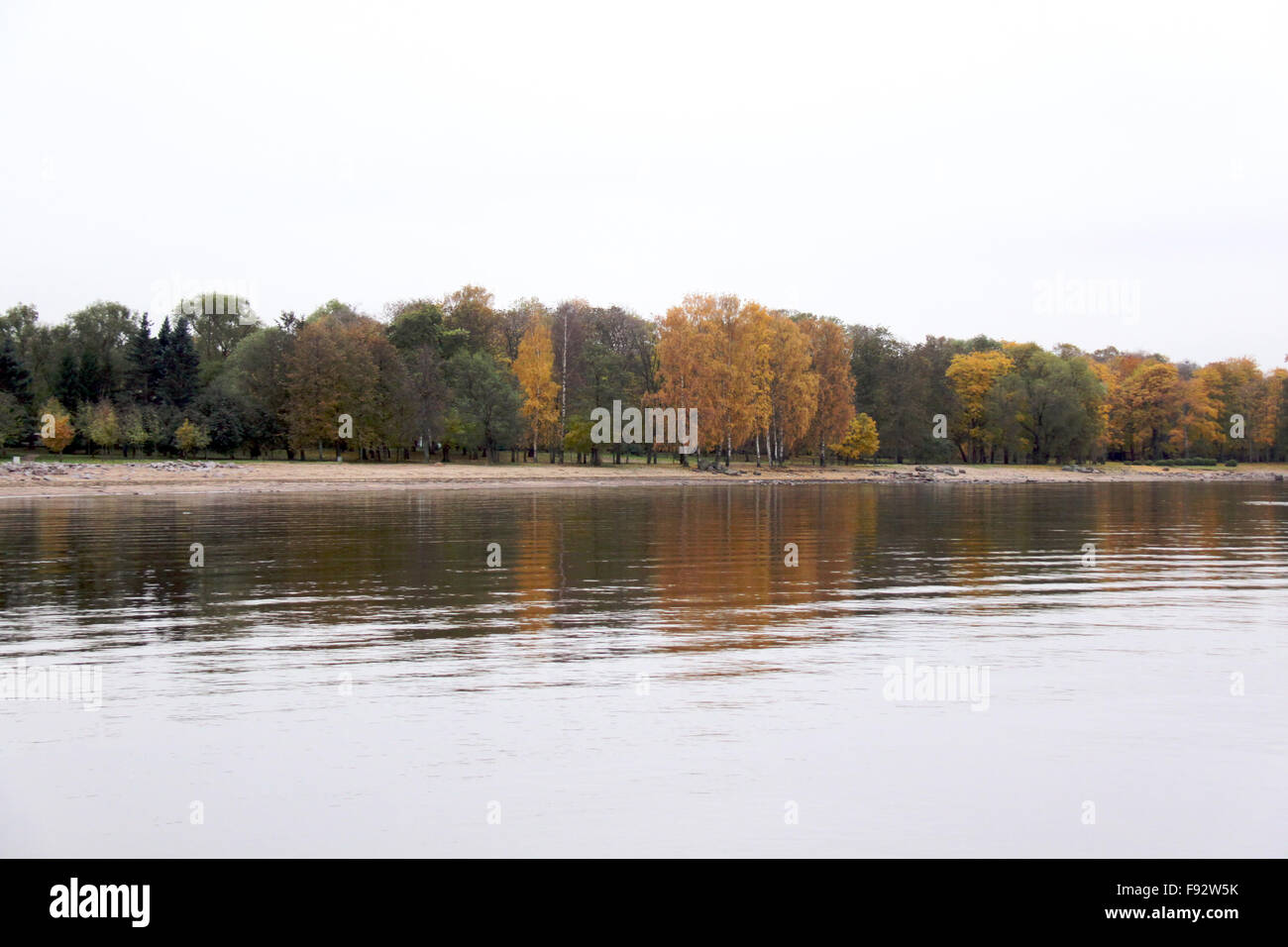 Colorful autumn trees fortress at the river front Stock Photo - Alamy