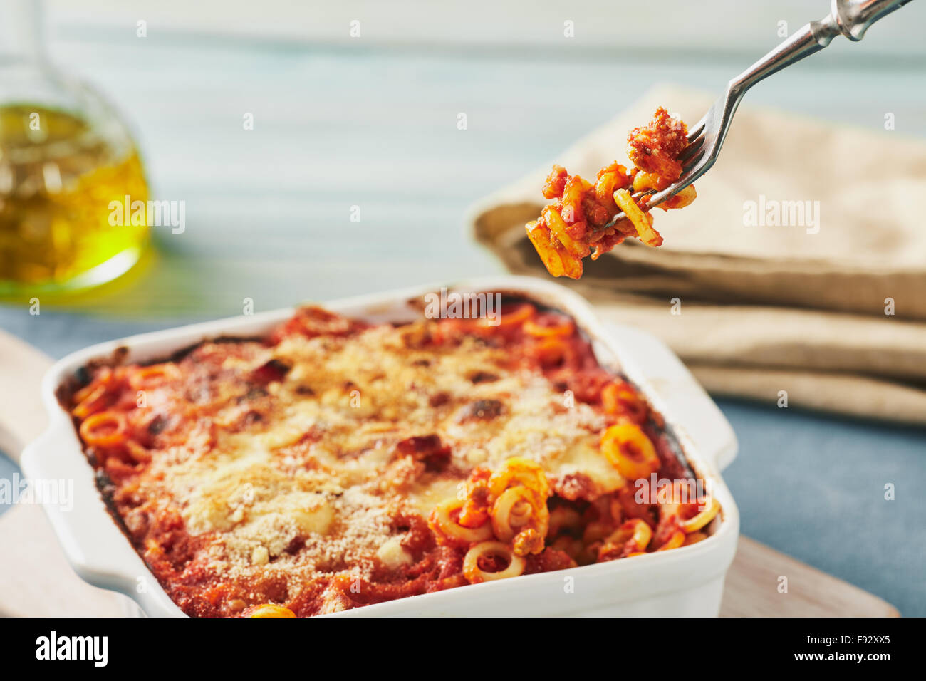 Baked anelletti pasta with mince, sauce and mozzarella. Typical ...