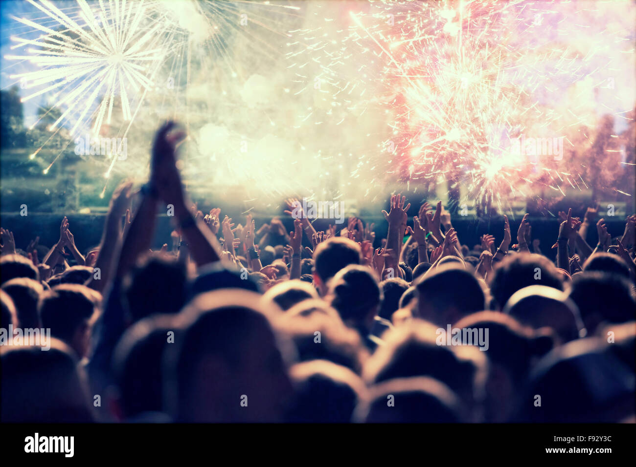 Cheering crowd and fireworks at New Year's Eve Stock Photo - Alamy