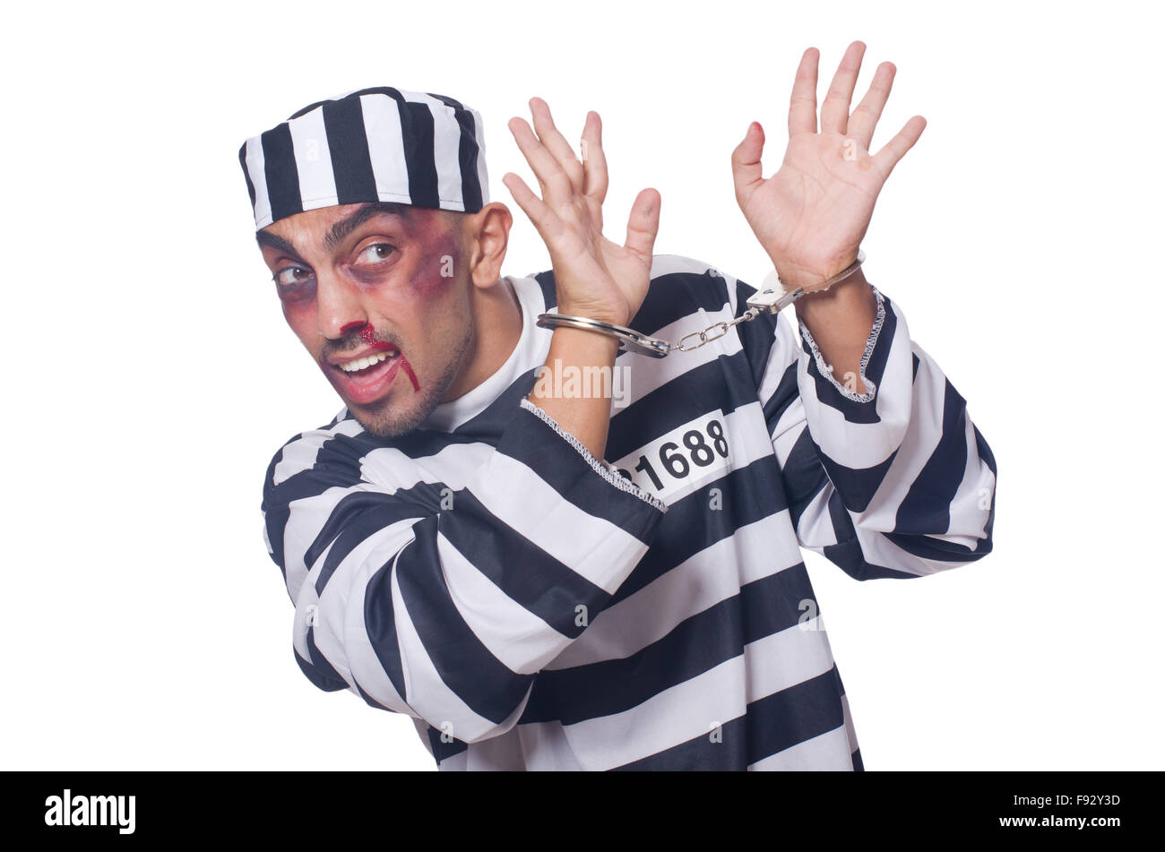 Badly bruised prisoner with handcuffs Stock Photo - Alamy