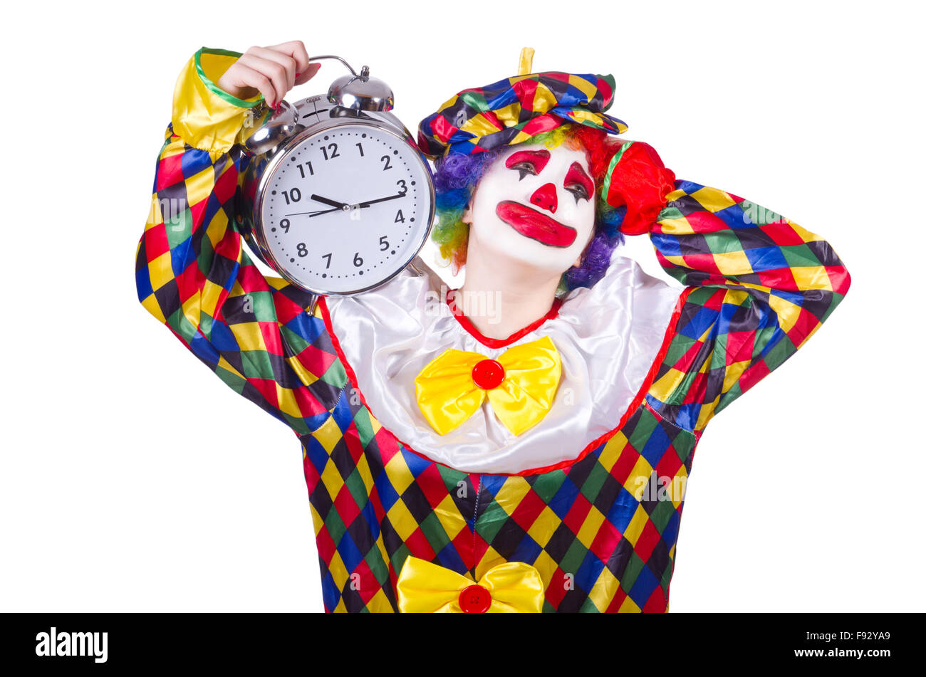 Clown with alarm clock isolated on white Stock Photo - Alamy