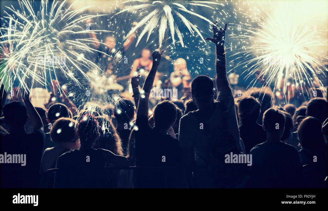 Cheering crowd and fireworks at New Year's Eve Stock Photo - Alamy