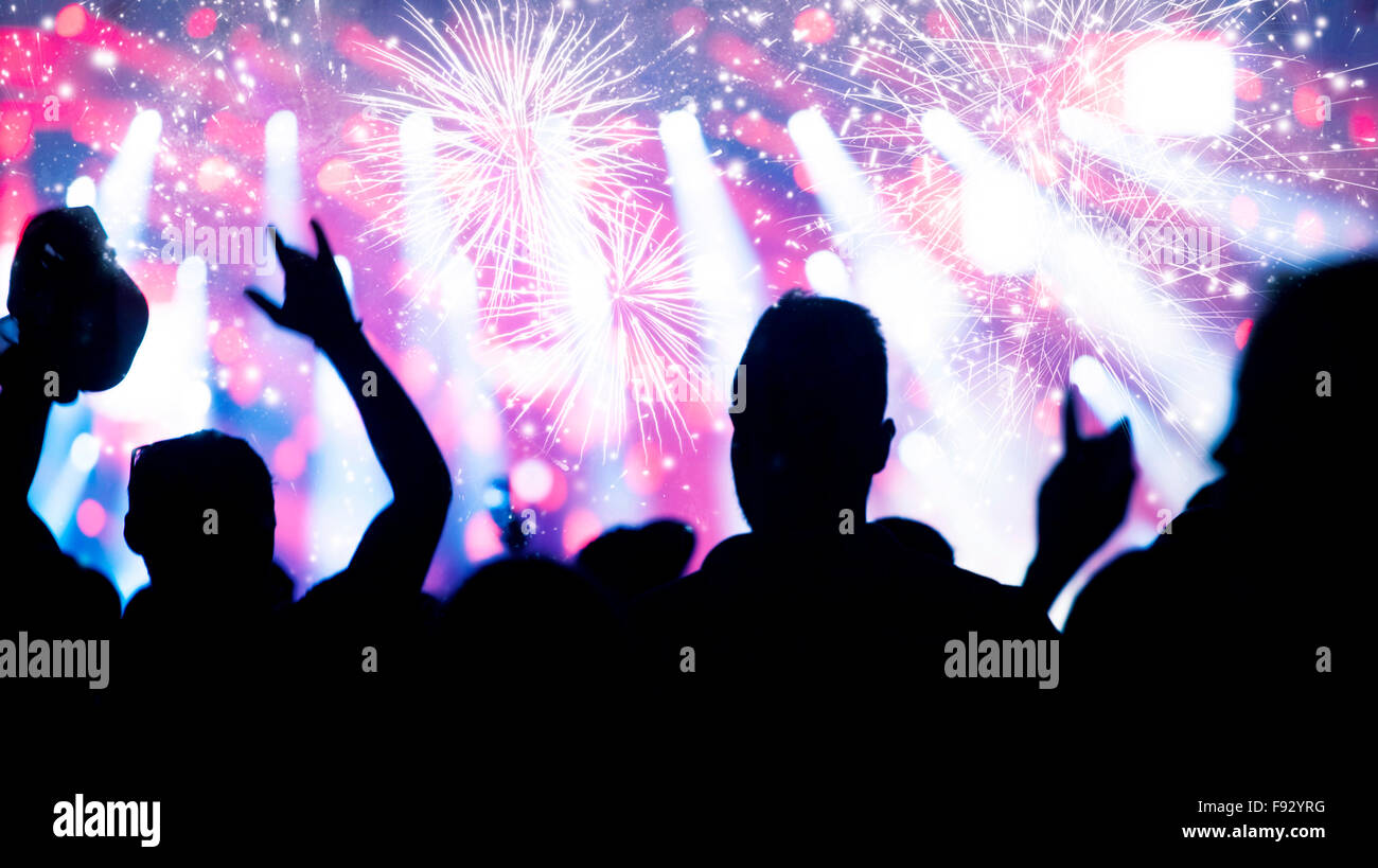 Cheering crowd and fireworks at New Year's Eve Stock Photo - Alamy