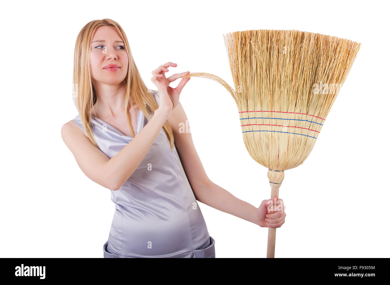 Young woman with broom on white Stock Photo - Alamy