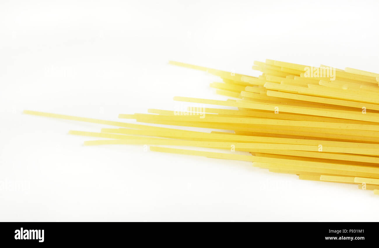 uncooked spaghetti noodles isolated on white background Stock Photo - Alamy
