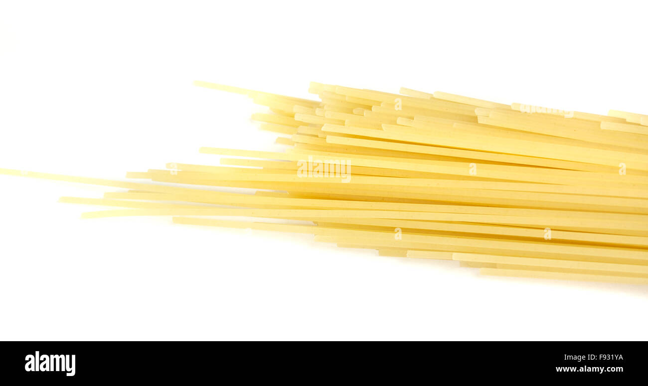 uncooked spaghetti noodles isolated on white background Stock Photo - Alamy