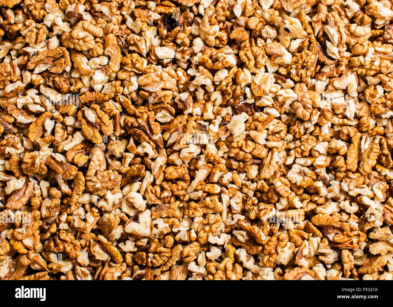 Peeled and crushed walnuts close up texture Stock Photo - Alamy