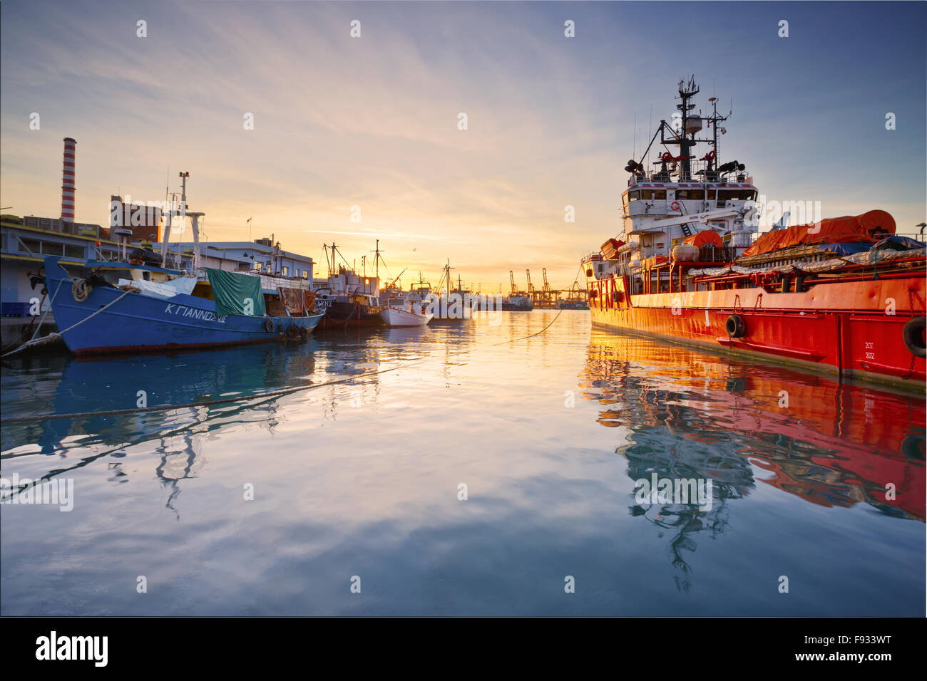 Fishing boats and a supply vessel at the central fish market in Piraeus ...