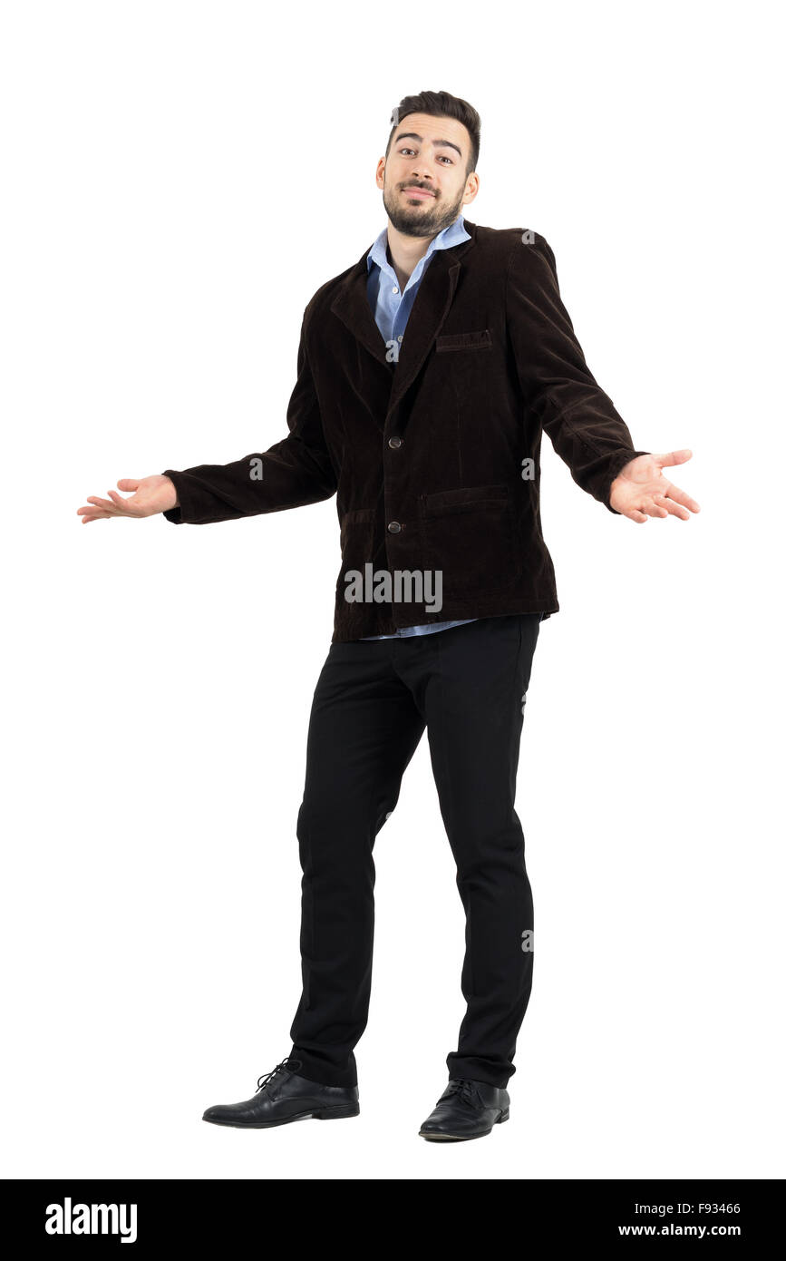 Funny puzzled fashionable man shrugging and smiling at camera. Full ...