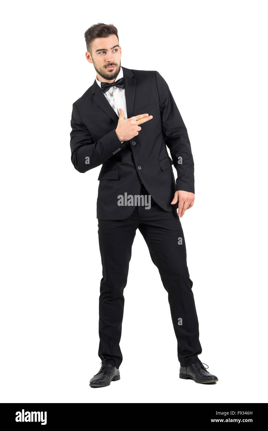 Funny secret agent with finger gun hand gesture looking away. Full body ...