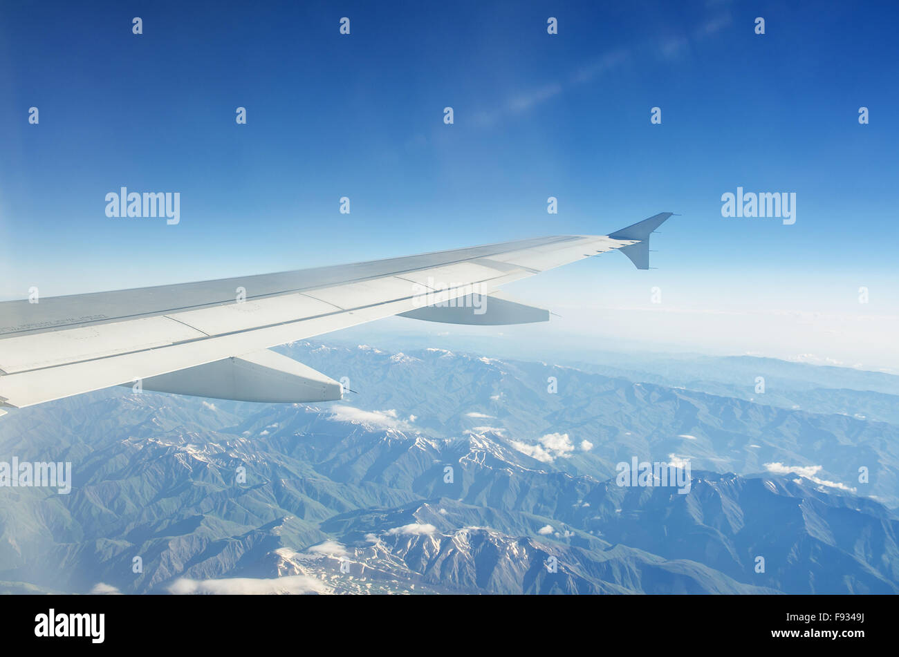 Airplane wing out of window Stock Photo - Alamy
