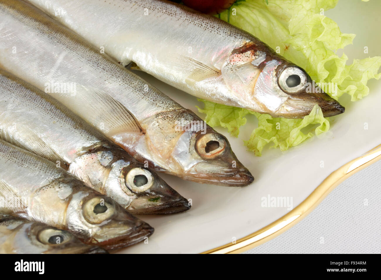 some smelts isolated on white background Stock Photo - Alamy