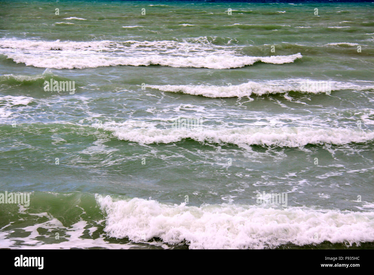 Waves on the Greek seashore Aegean sea Stock Photo - Alamy