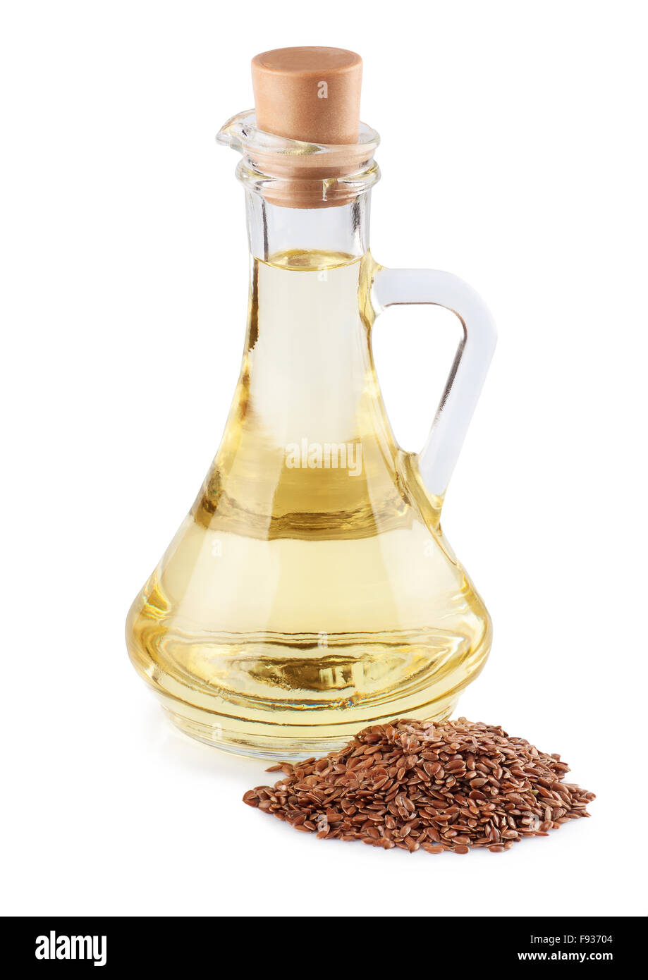 Linseed oil in a glass jug and flax seeds isolated on white background ...