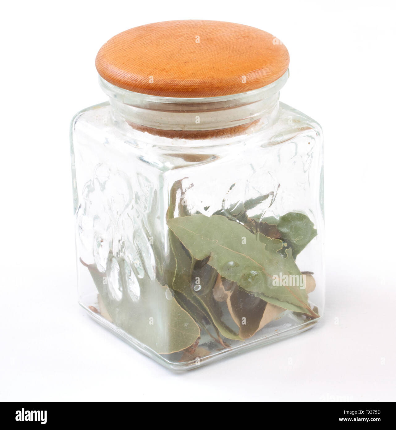 laurel leaves in the jar isolated on white Stock Photo - Alamy