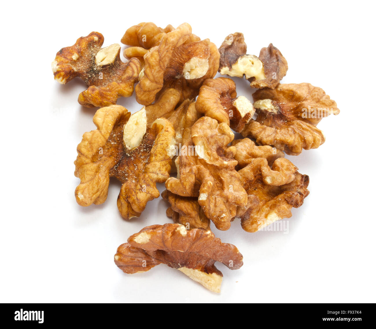 Crushed walnuts on white background Stock Photo - Alamy