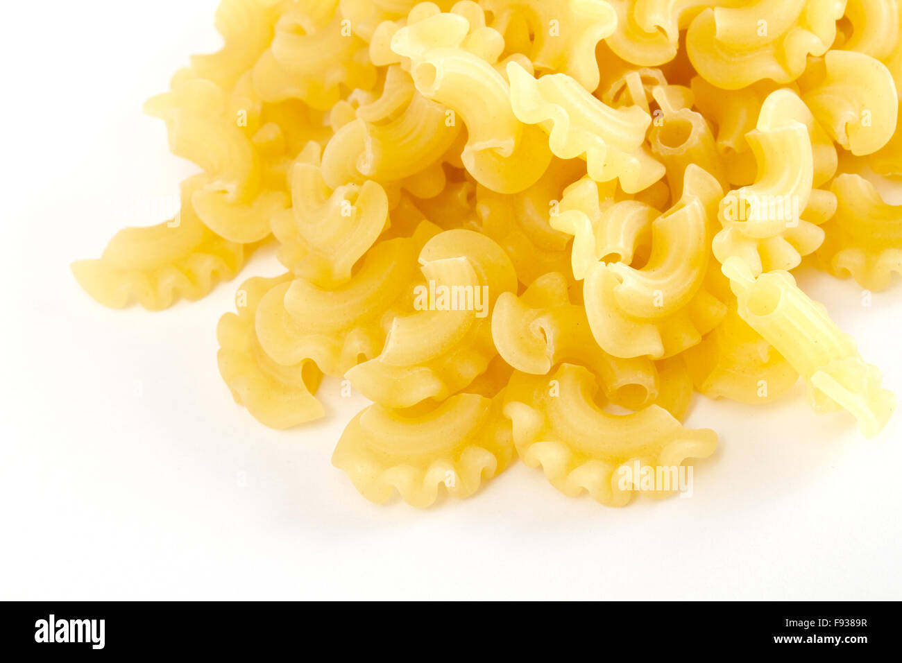dried italian pasta (macaroni) isolated on white background Stock Photo ...