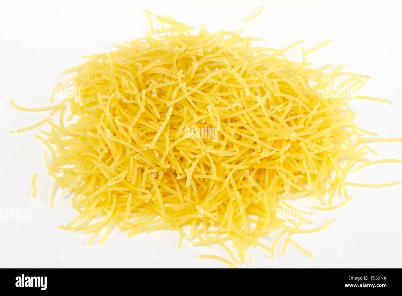 dried italian pasta (macaroni) isolated on white background Stock Photo ...
